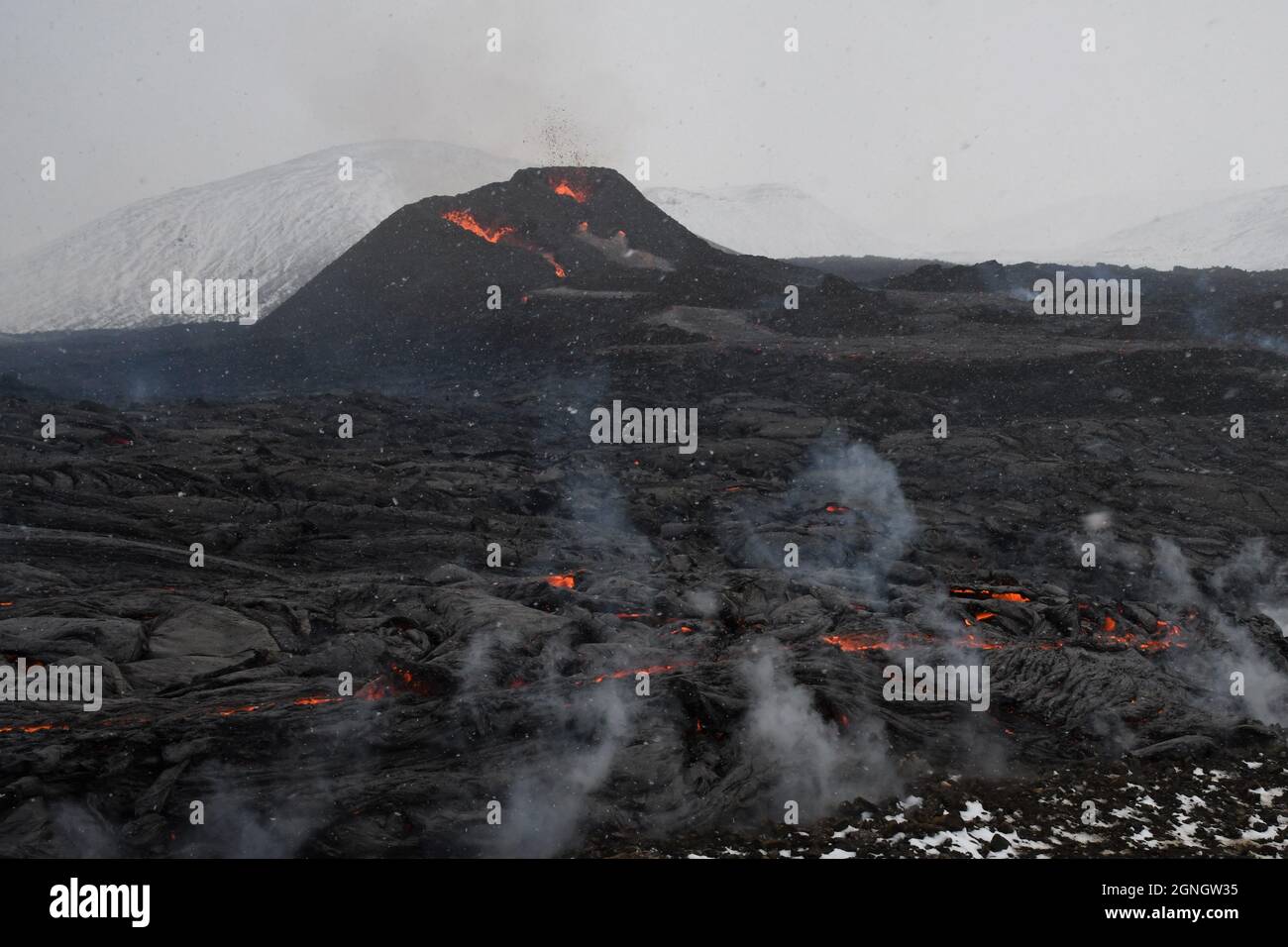 Two vents at Fagradalsfjall volcanic eruption, Iceland. Crusted black ...