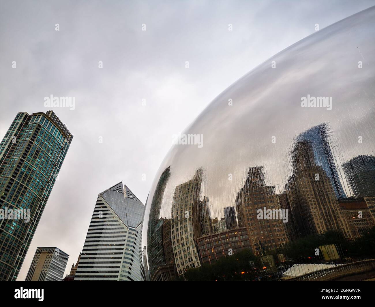 Skyscrapers near creative reflection of skyscrapers in a mirrored ...