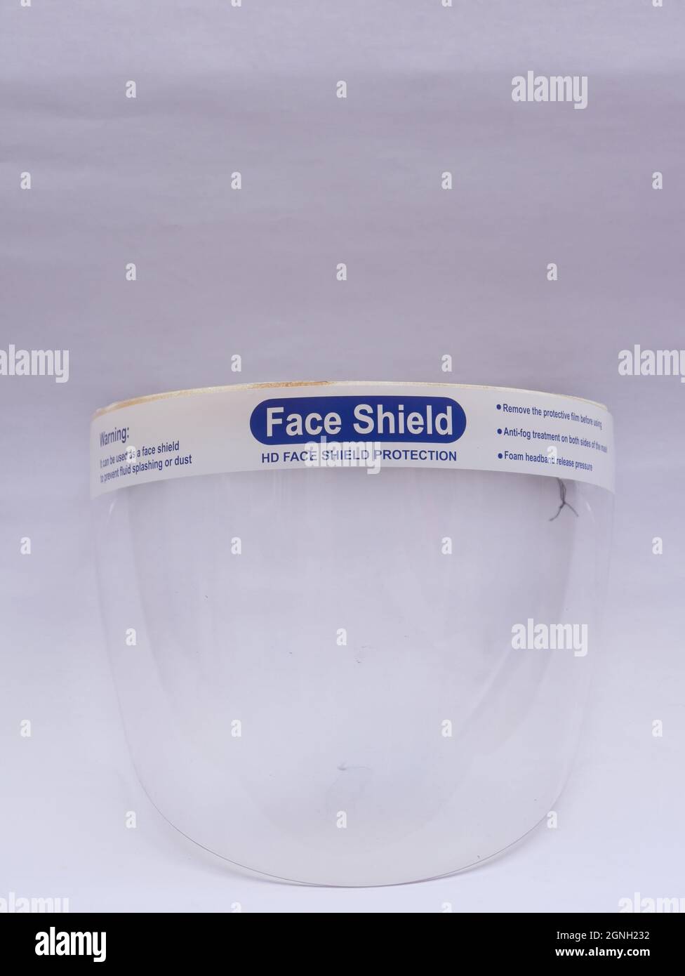 Top view of a transparent medical face shield with a white background ...