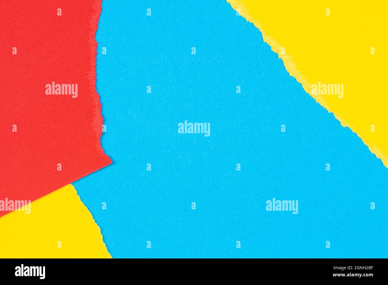 Torn grunge ripped yellow, blue, red geometric paper background ...