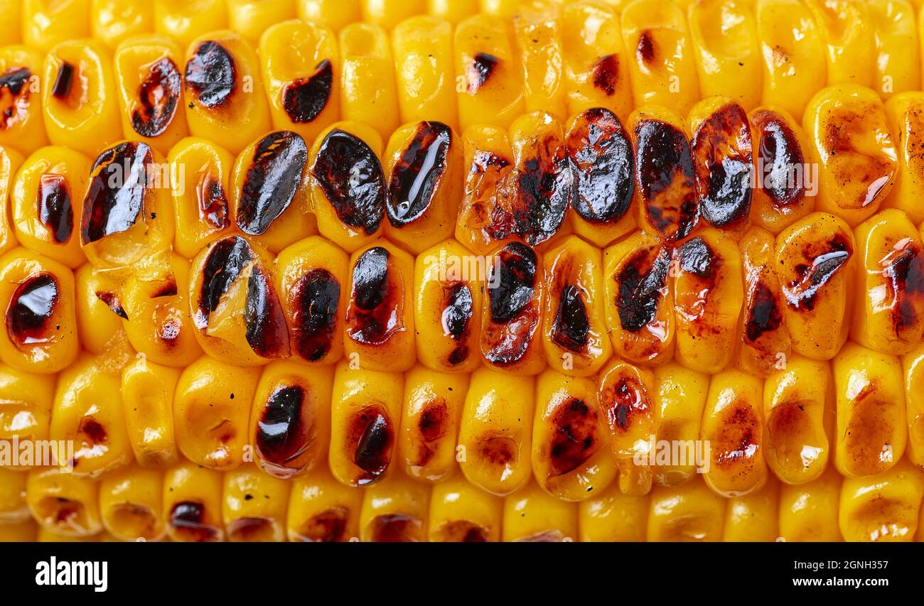 grilled sweet corn macro background, top view Stock Photo - Alamy