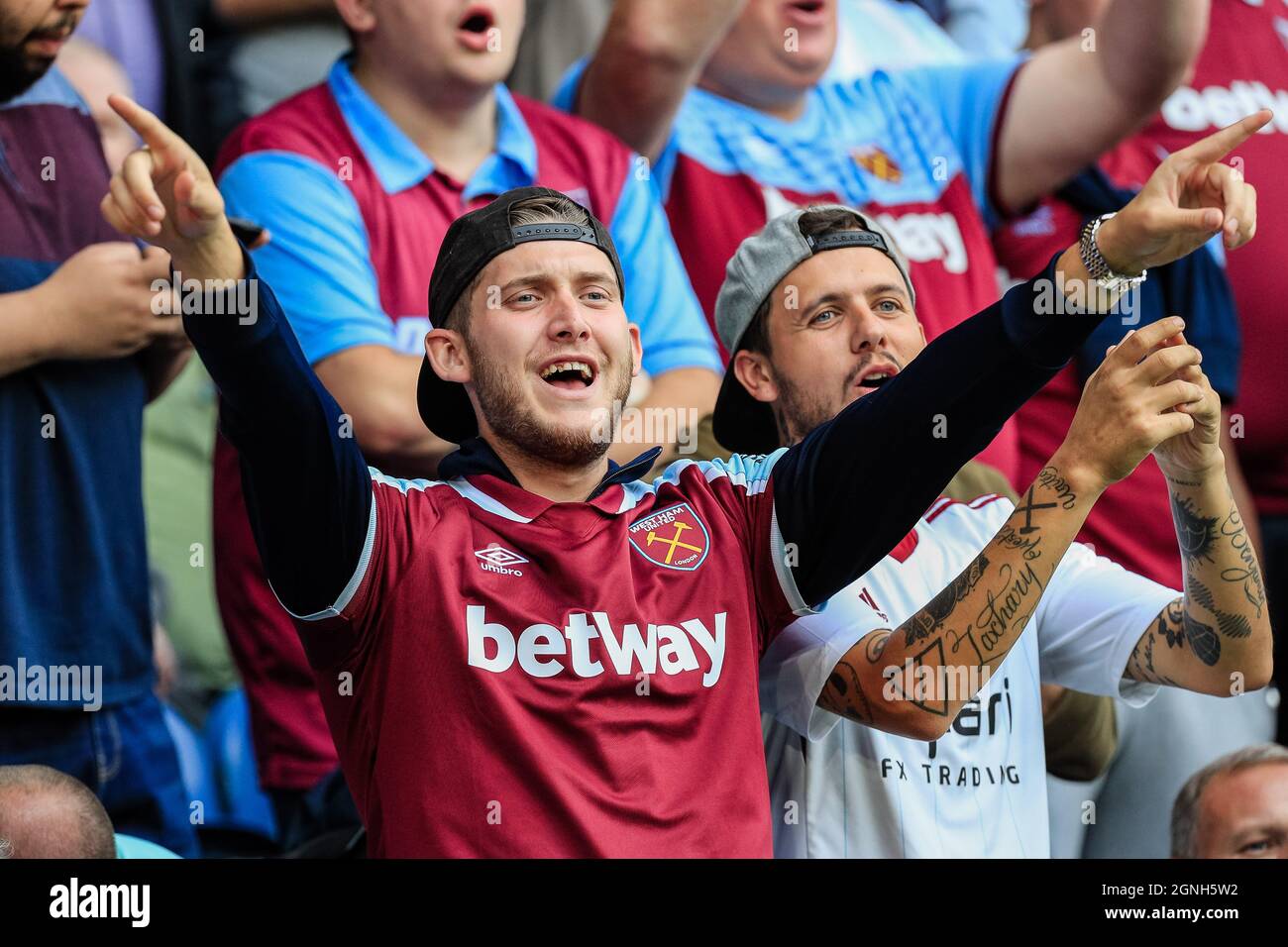 West Ham fans cheer on their team before the game Stock Photo - Alamy