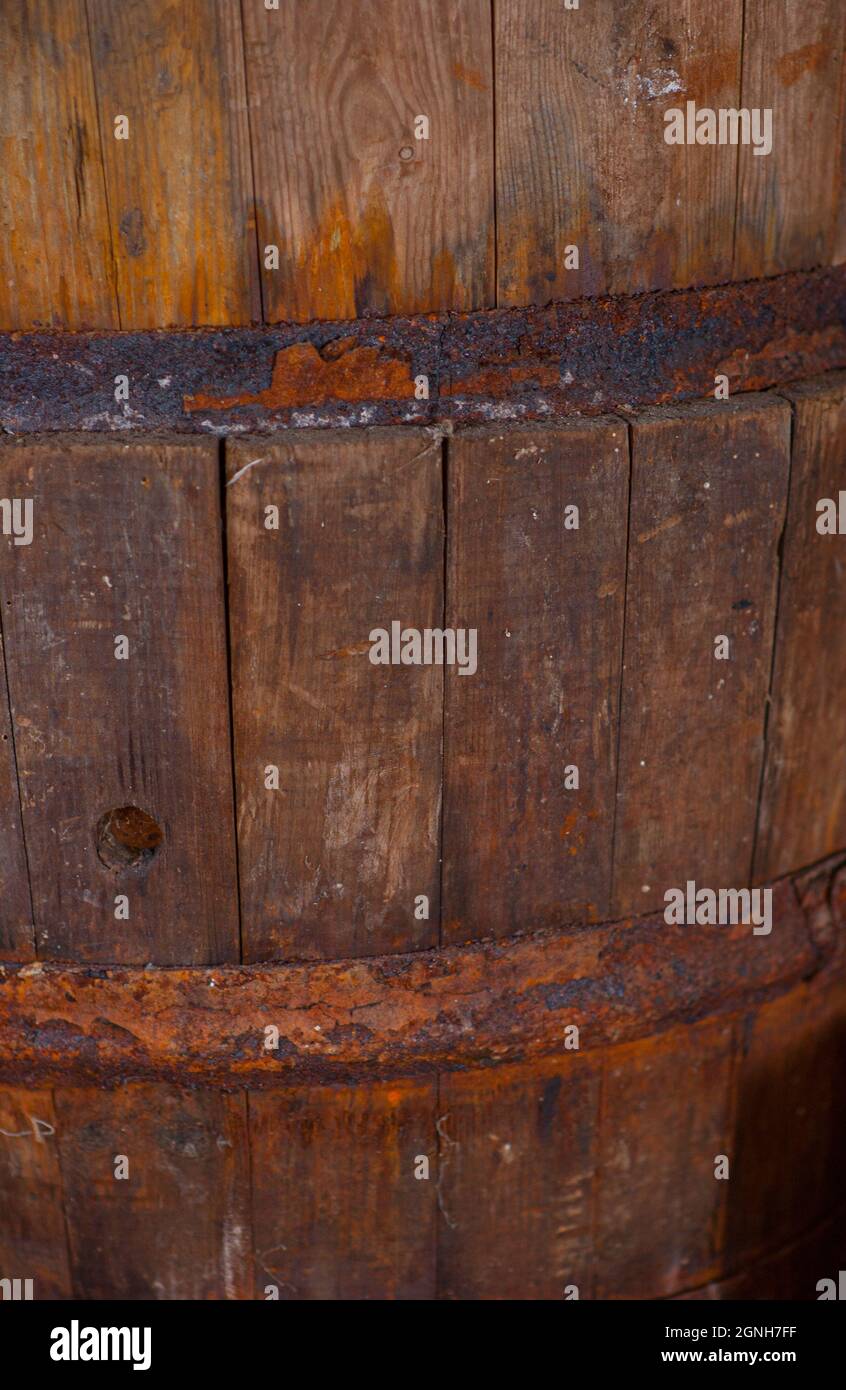 Old and worn wooden buckets with rusty metal hoops Stock Photo - Alamy
