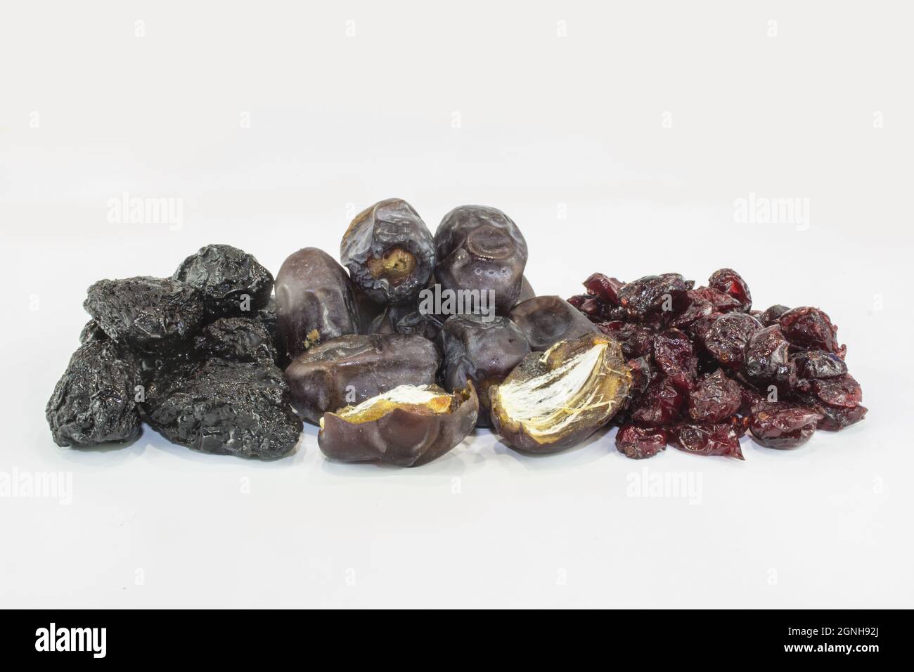 Bunch of different types of dried fruits with a white background Stock ...