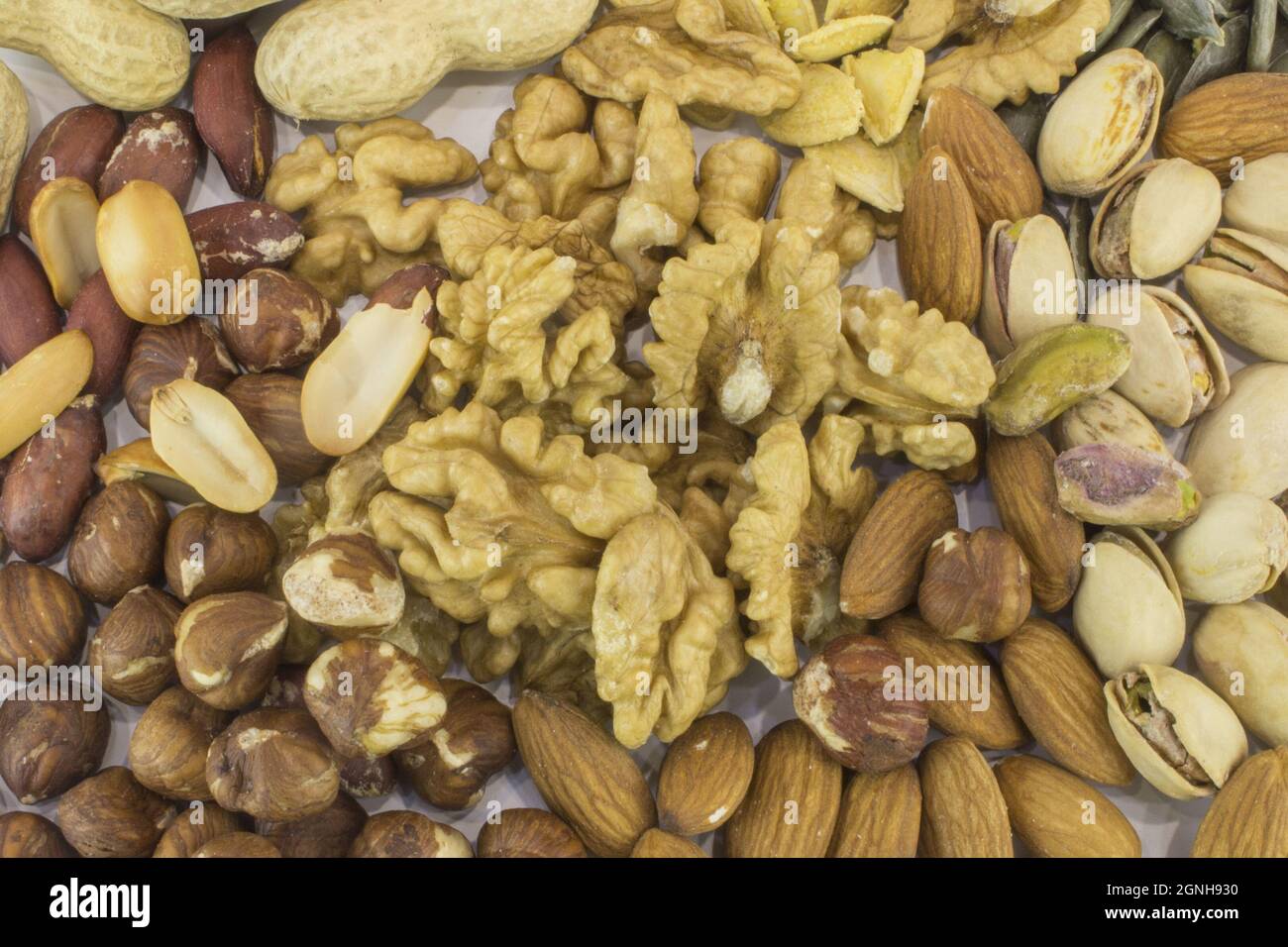 Top view of a bunch of different types of raw nuts Stock Photo - Alamy