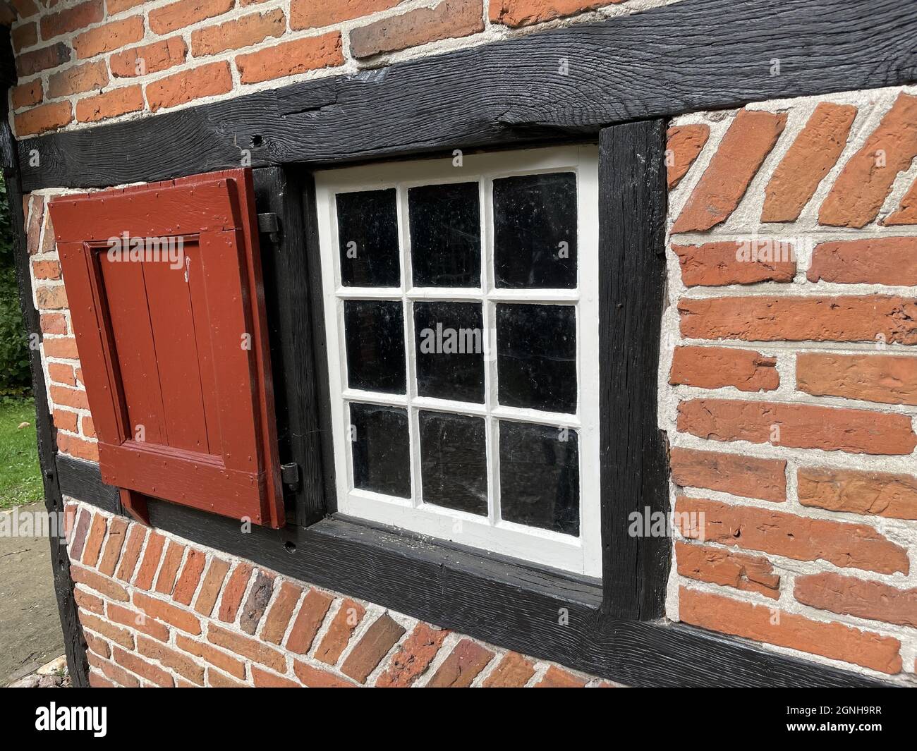 Closeup of a small window outside a brick house Stock Photo - Alamy