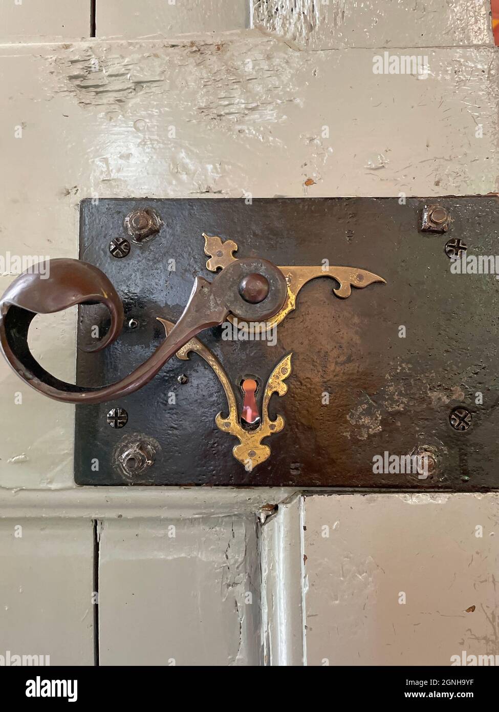 Vertical shot of a rusted metal door knob on a wooden door Stock Photo ...