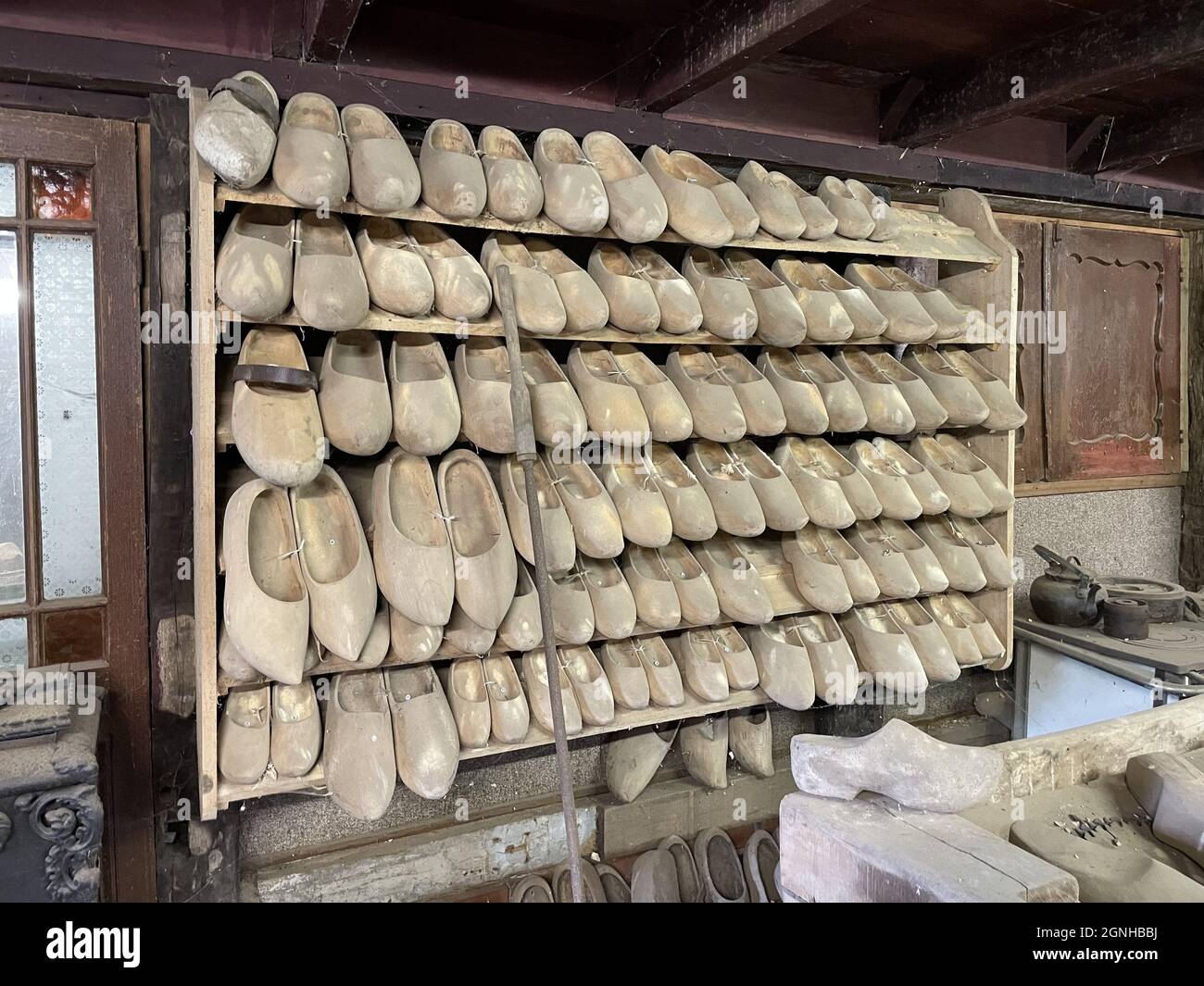 Warehouse with a hoard of wooden shoes kept on shelves Stock Photo - Alamy