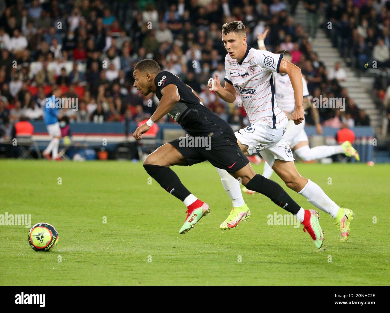 Kylian Mbappe of PSG, Maxime Esteve of Montpellier during the French ...