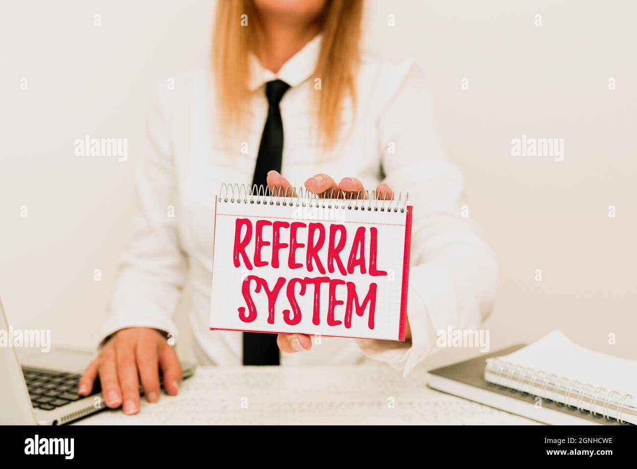 Hand writing sign Referral System. Business idea sending own patient to ...