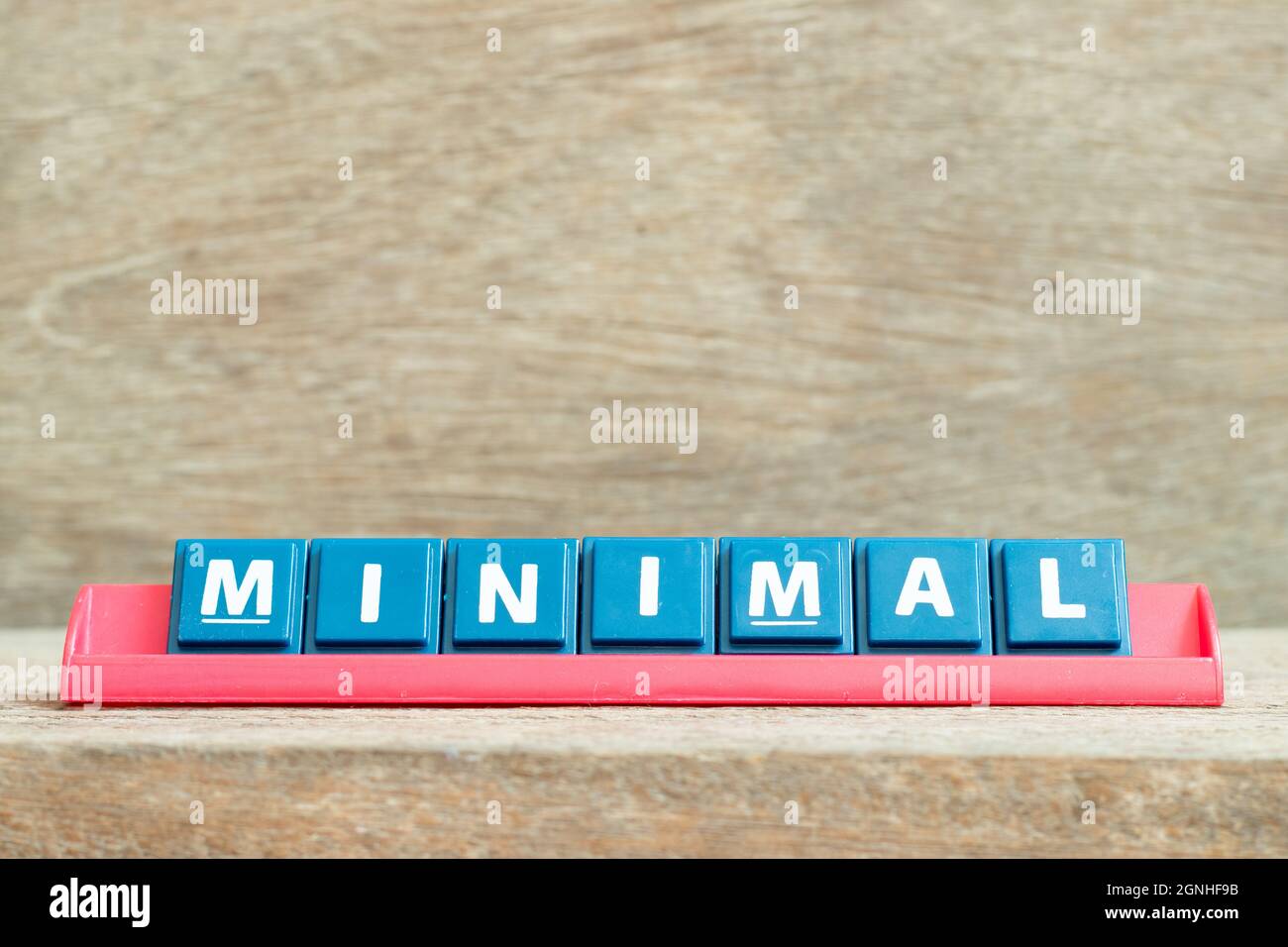 Tile alphabet letter with word minimal in red color rack on wood ...