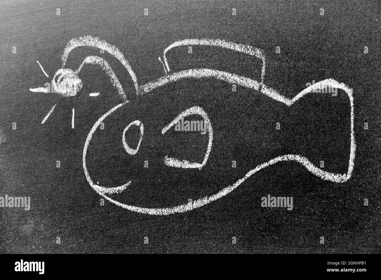 White color chalk hand drawing in angler fish or lantern fish shape on ...