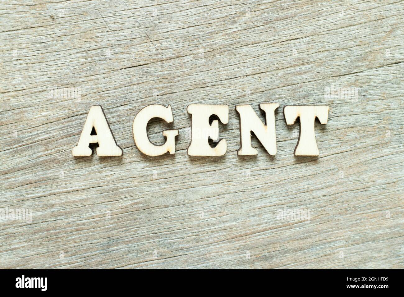 Alphabet letter in word agent on wood background Stock Photo - Alamy