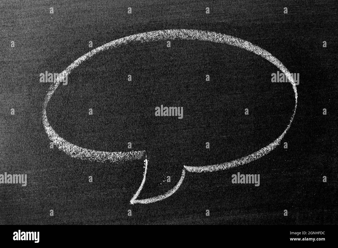 White color chalk hand drawing in round bubble speech shape with blank ...