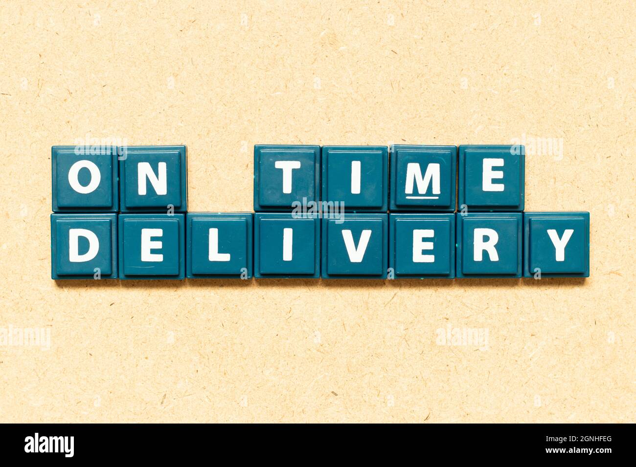 Tile alphabet letter in word on time delivery on wood background Stock ...