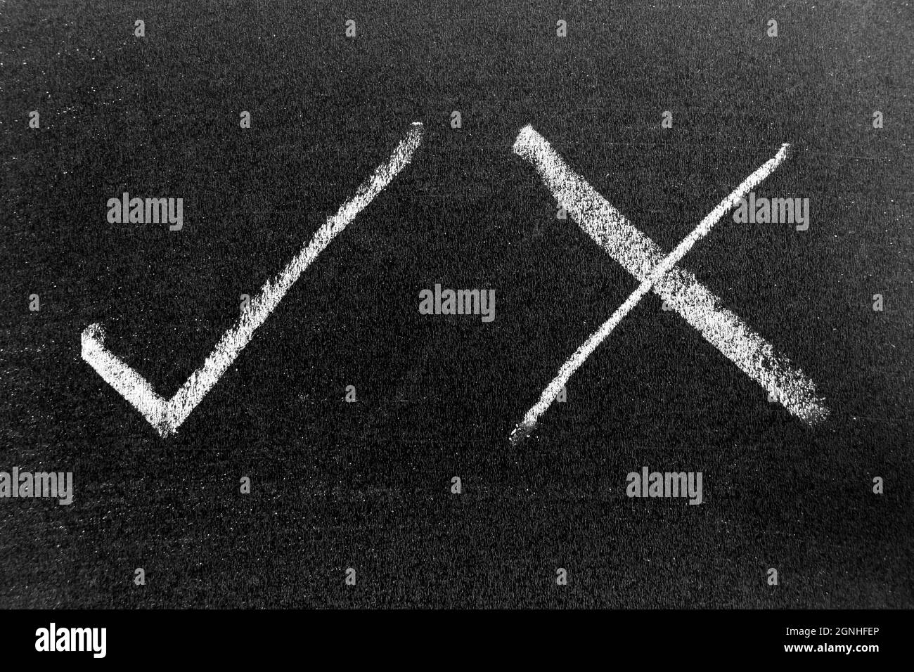 White color chalk hand drawing in check mark of right and wrong shape ...