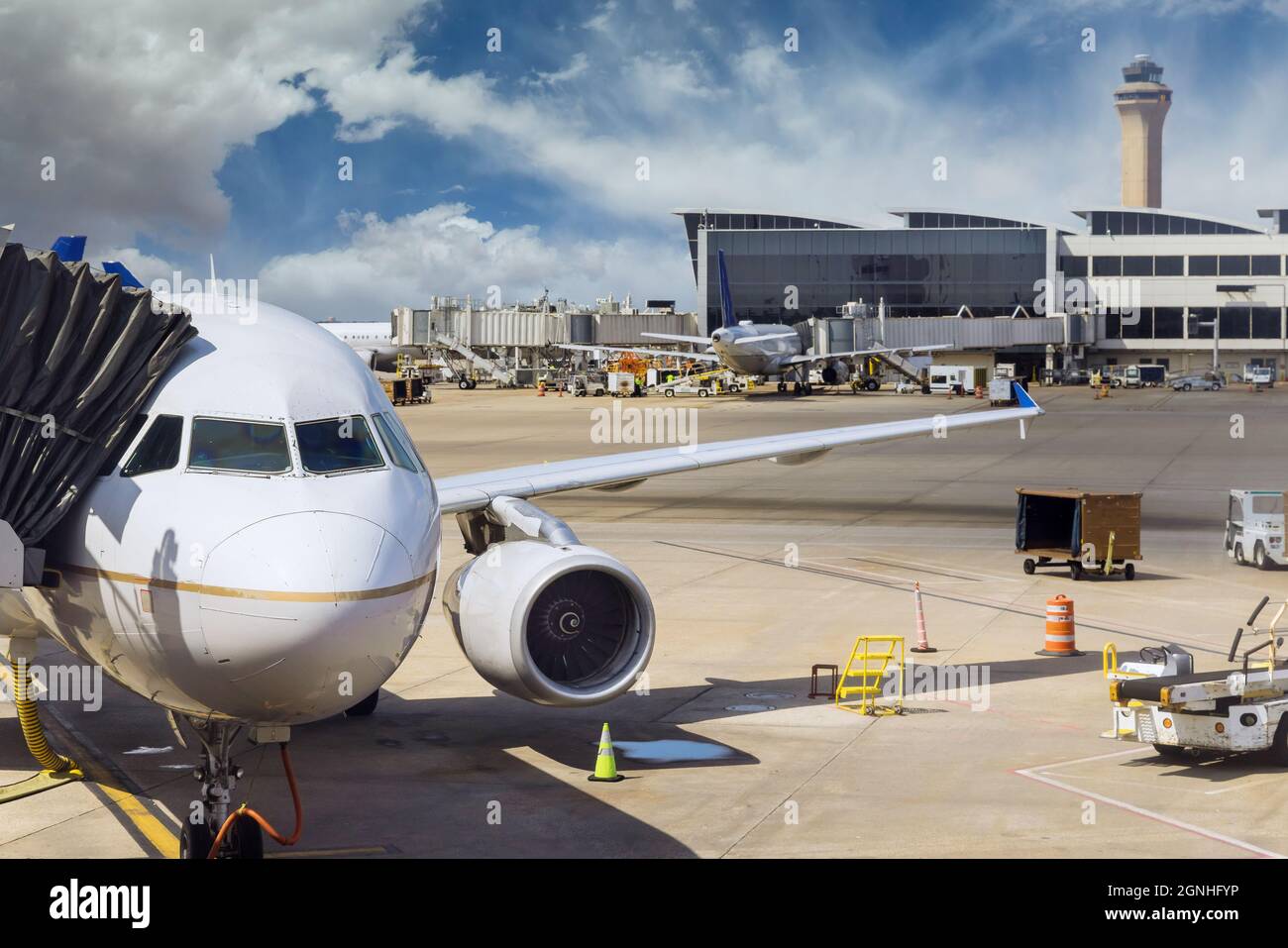 Parking at terminal gate passenger aircraft at the connected bridge is ...
