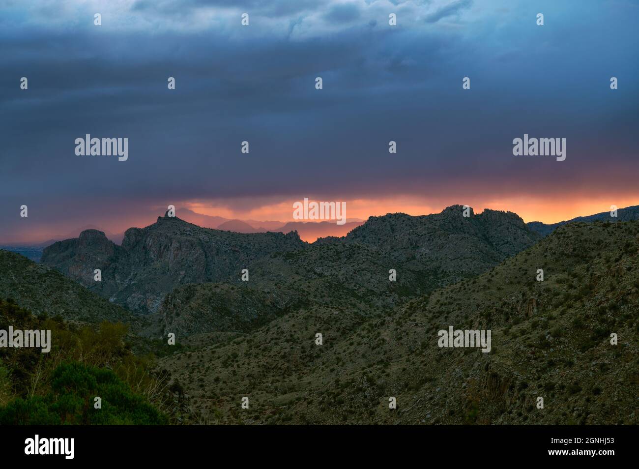Dramatic sunset sky with monsoon rain over Thimble Peak in Tucson Stock ...