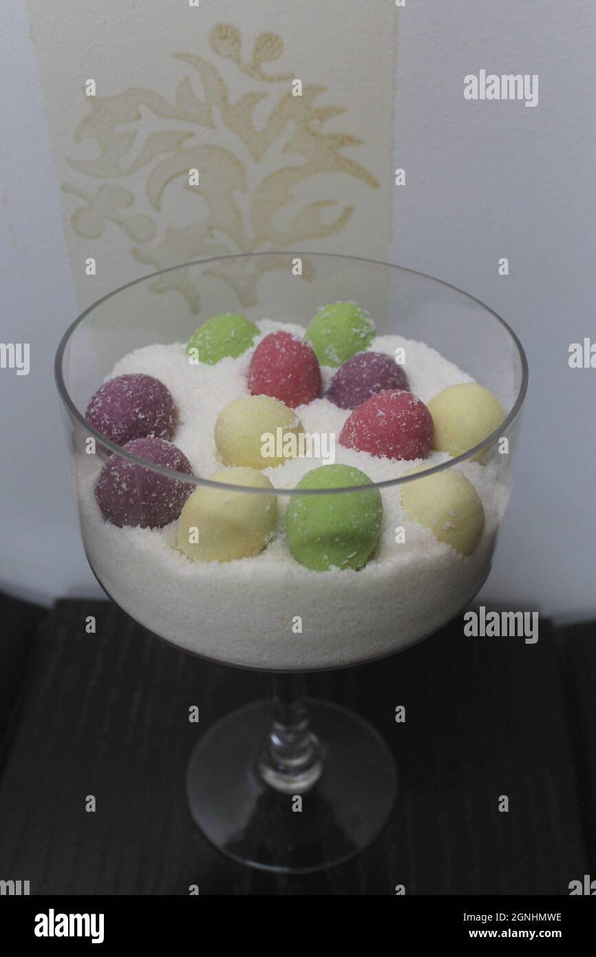 Colorful candies of yellow, red, violet and green, presented in a ...