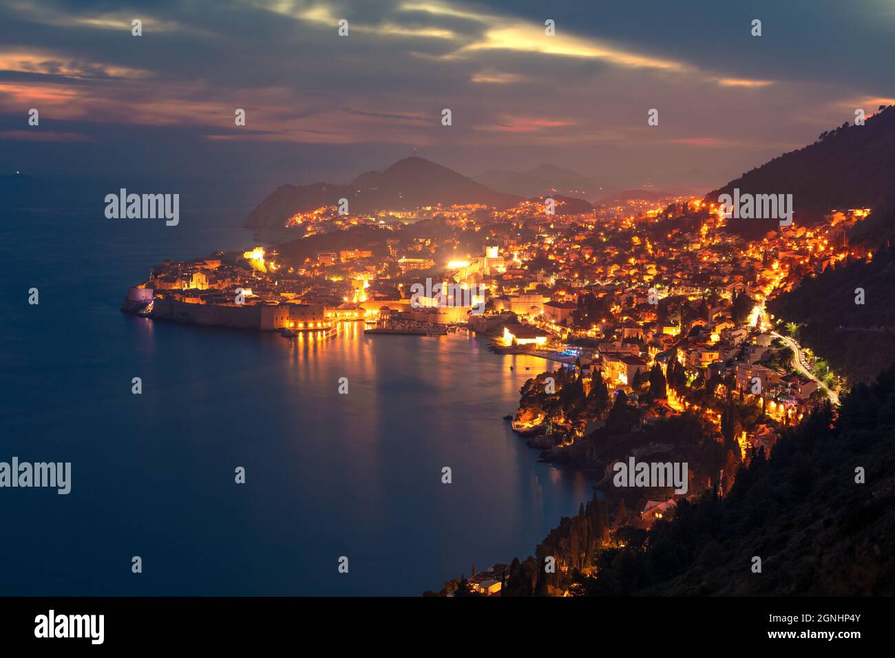 Aerial night view of Dubrovnik city. Great summer sunset in Croatia ...