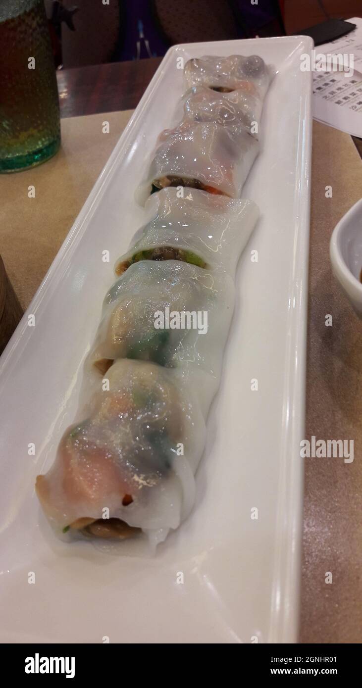 Rice rolls and other dim sum in a market in Hong Kong Stock Photo - Alamy