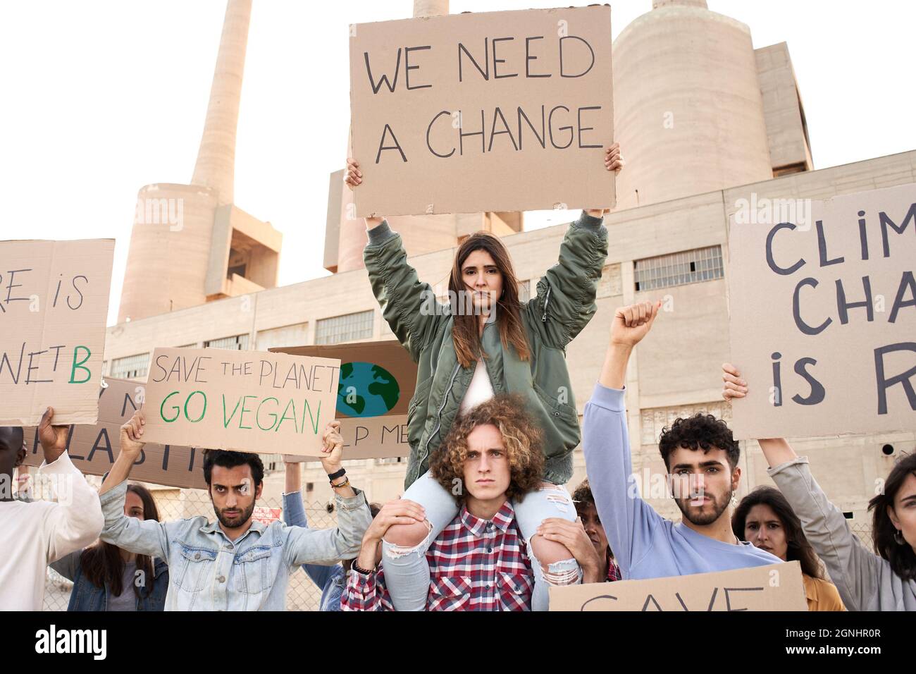 People with banners protest as part of a climate change march Stock ...