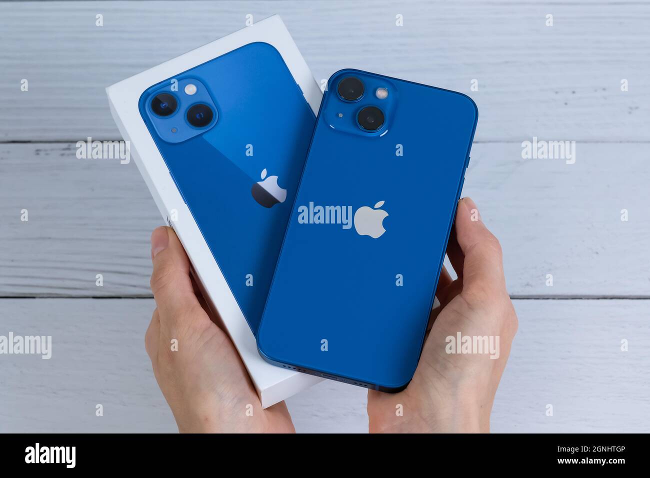 iPhone 13 in blue Stock Photo - Alamy