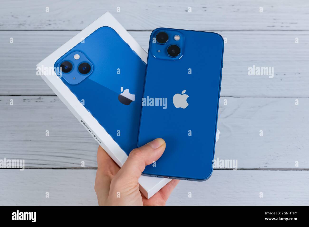 iPhone 13 in blue Stock Photo - Alamy