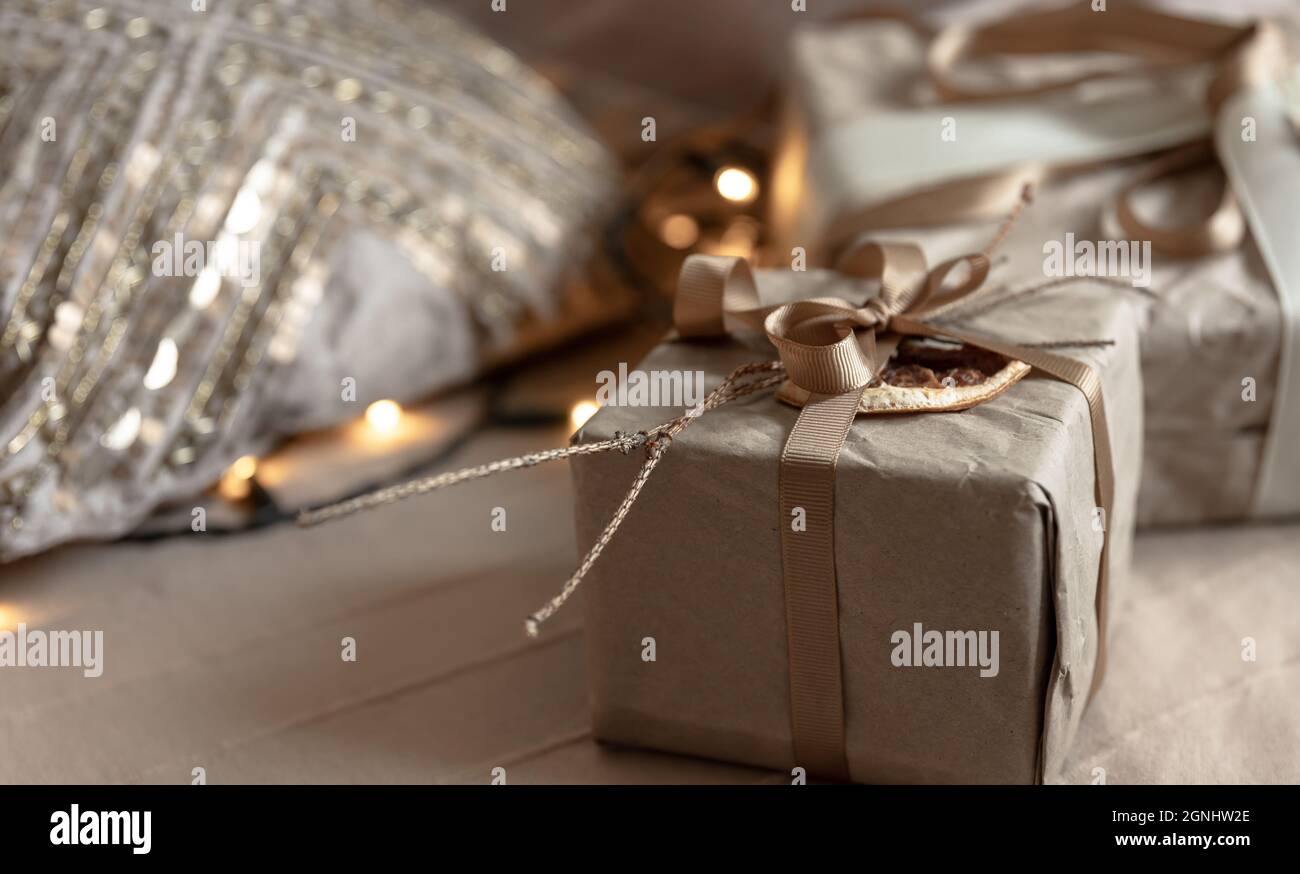 Close-up of a Christmas gift box, decorated with dried flowers and a ...