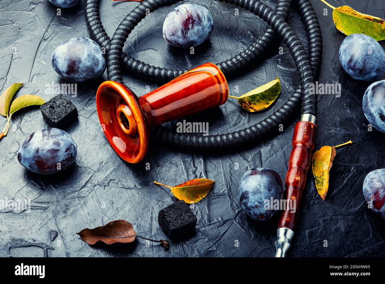 Eastern smoking hookah with plum flavored tobacco.Fruit shisha Stock ...