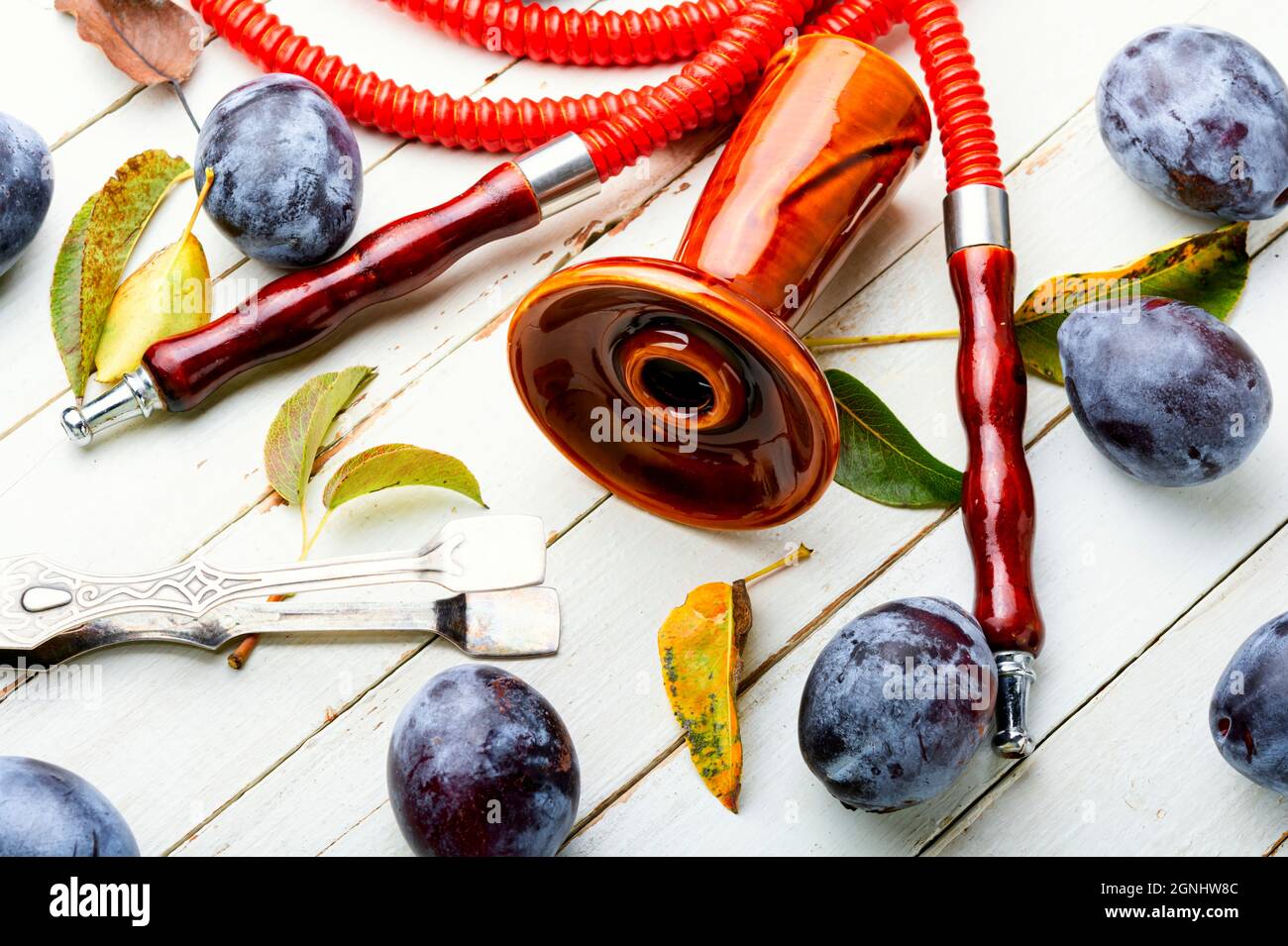 Smoking hookah with plum flavored tobacco.Fruit shisha Stock Photo - Alamy