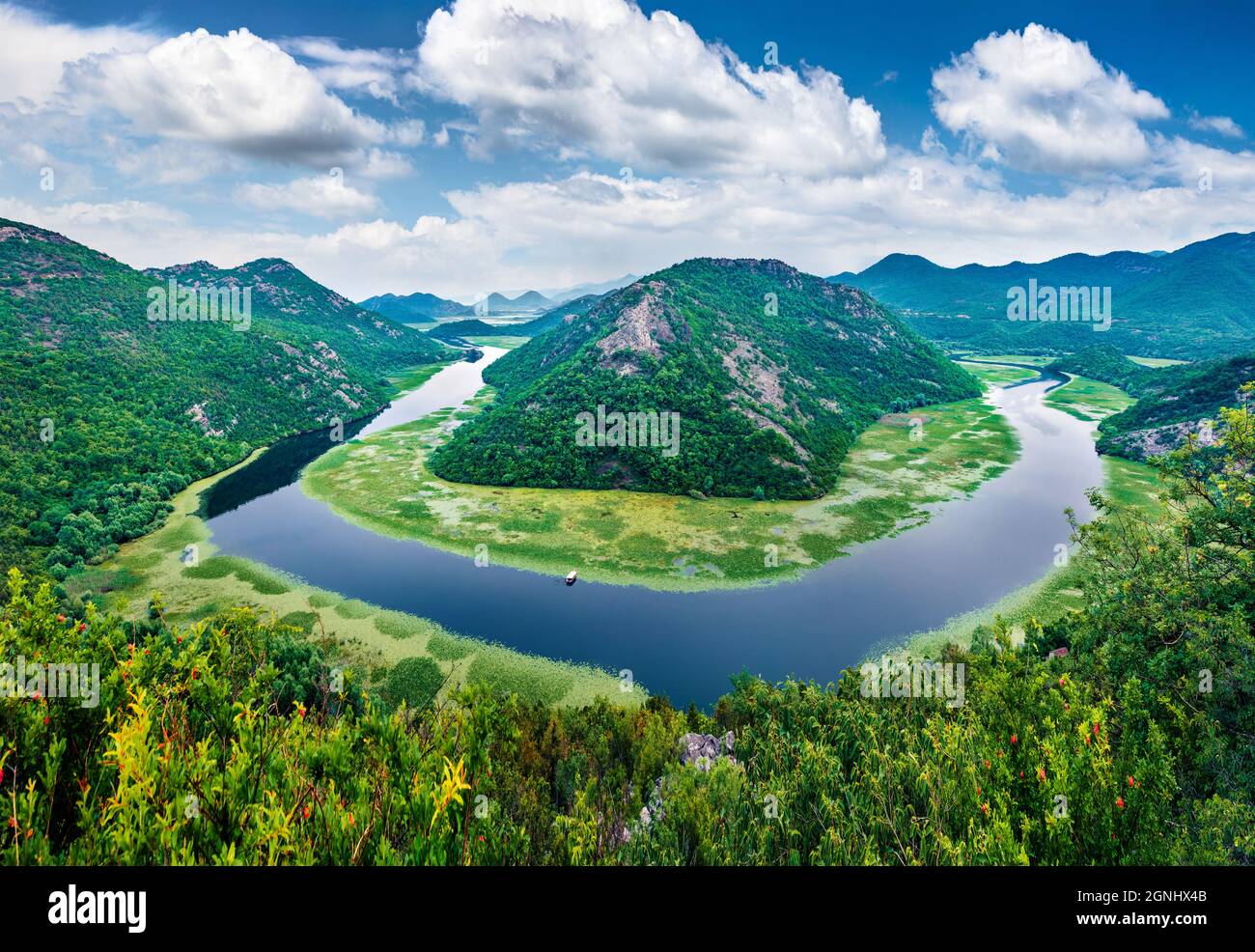 River envelops the horn peak in the ring. Aerial view of Canyon of Rijeka Crnojevica river ...