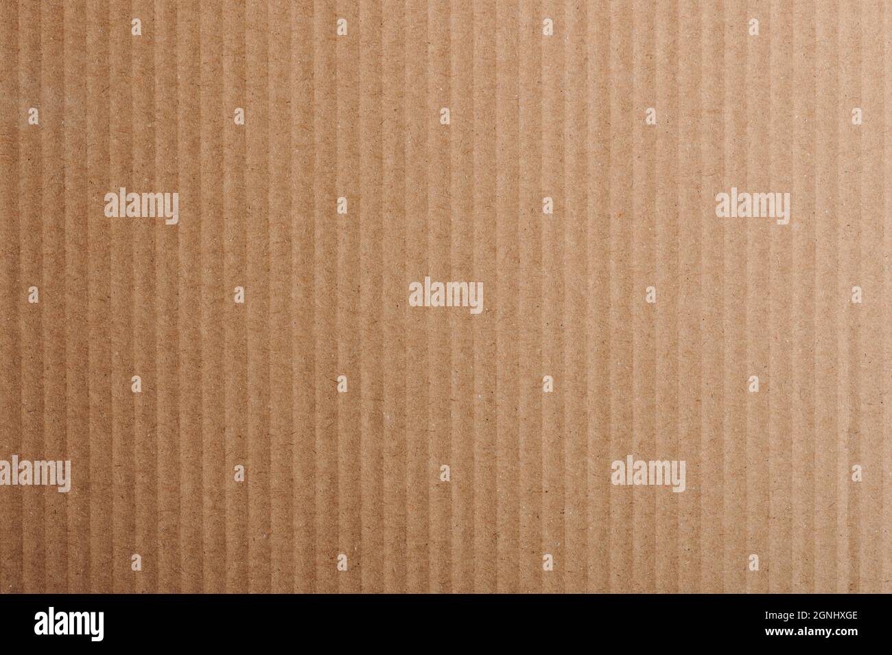 Brown cardboard sheet striped background close up view Stock Photo - Alamy
