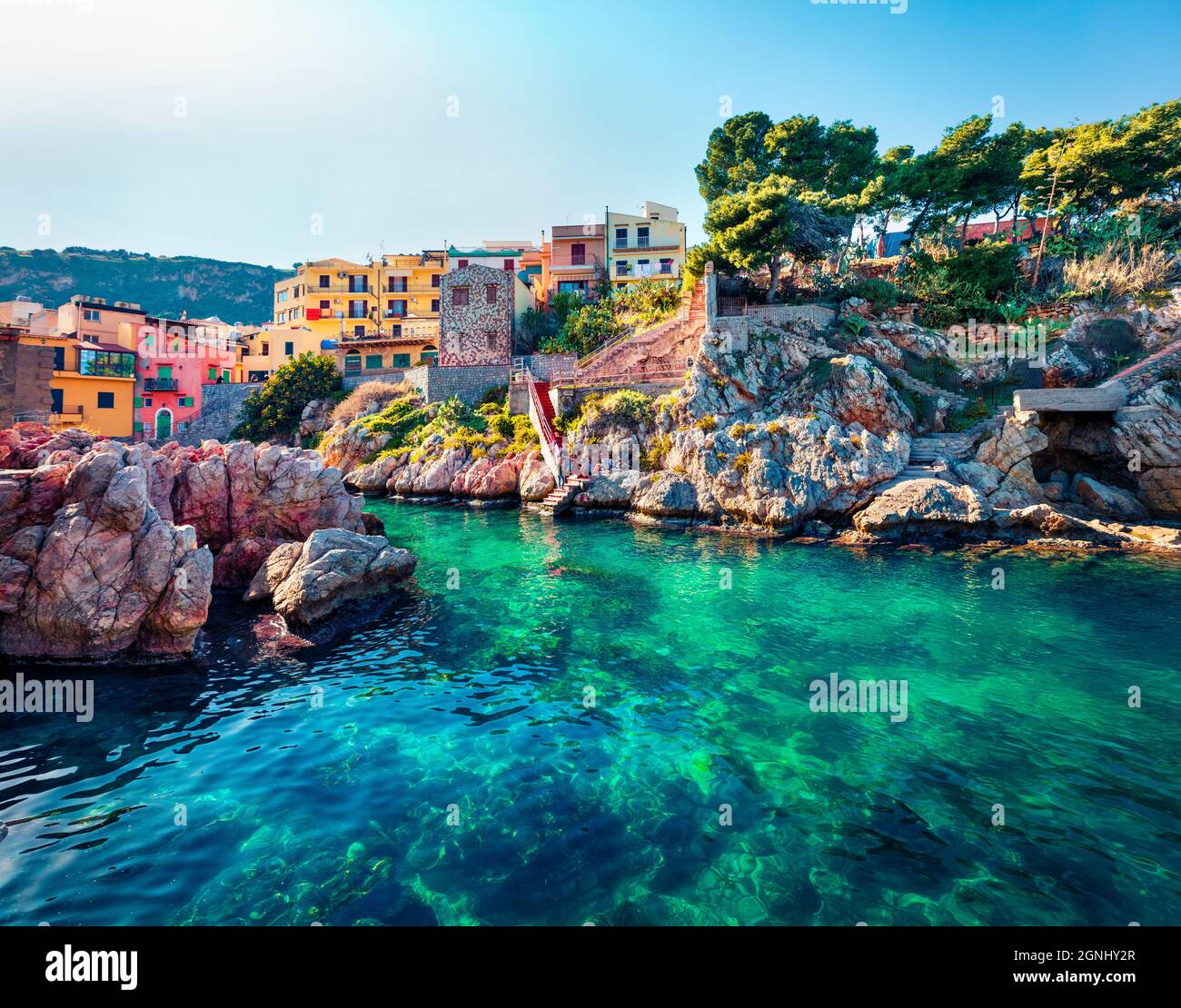 Sunny spring view of Sant' Elia village. Splendid azure water bay on ...