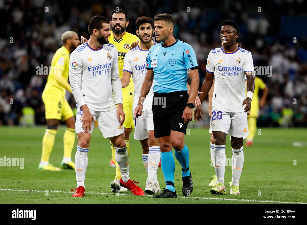 Nacho Fernandez of Real Madrid with a referee during the La Liga match ...