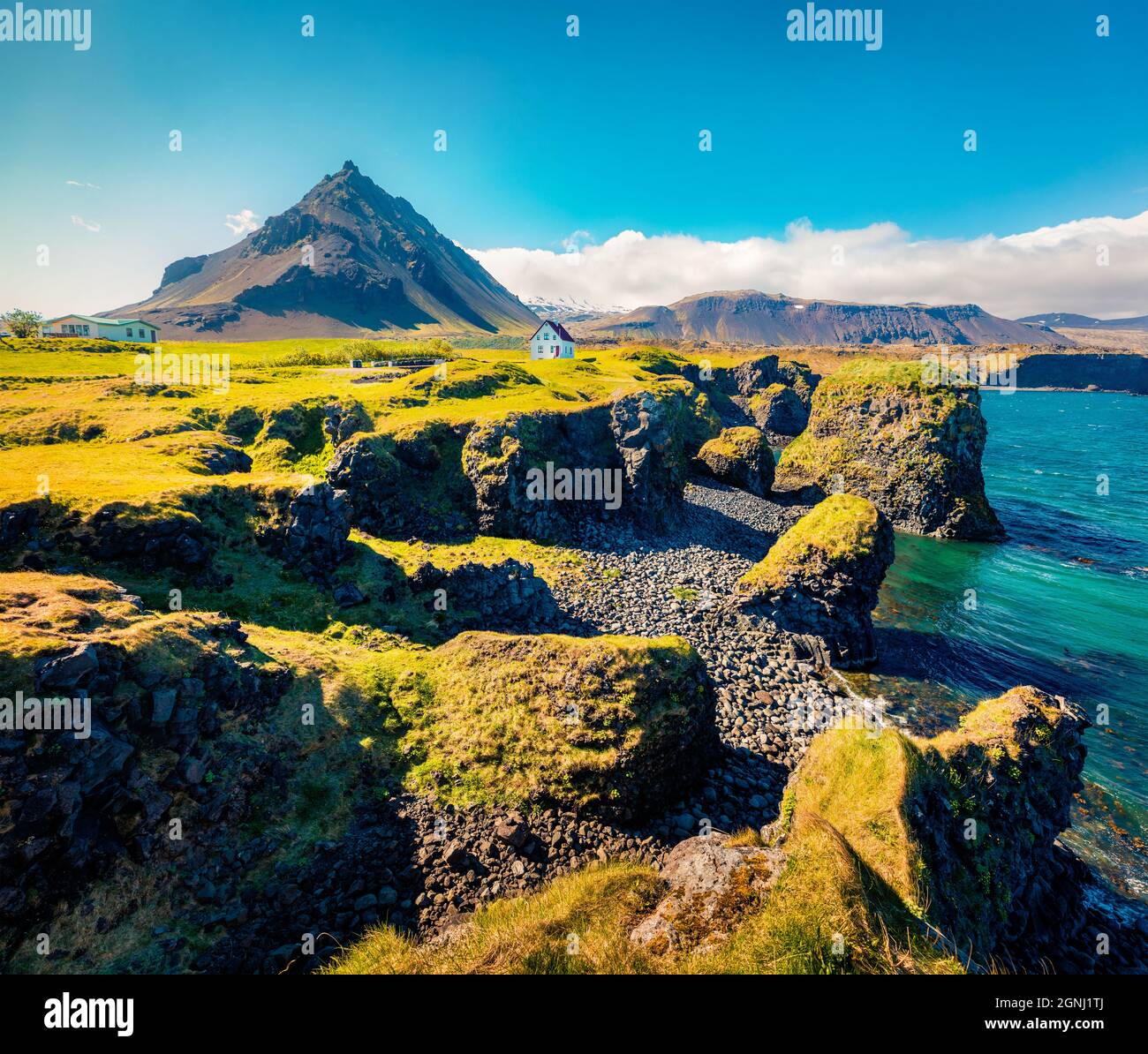 Captivating summer view of small fishing village at the foot of Mt ...