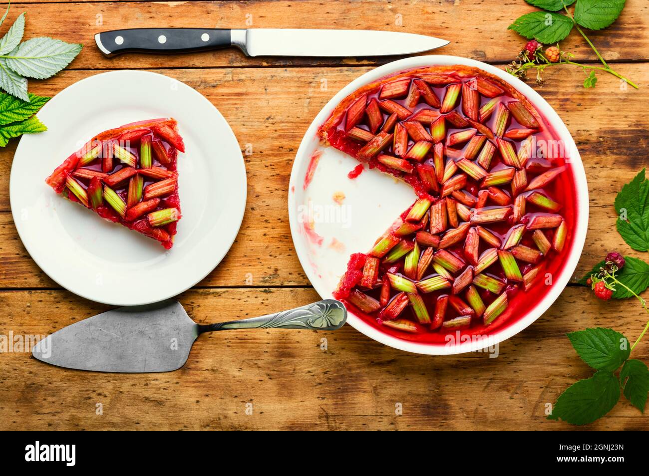 Seasonal pie or cake with rhubarb stalks and raspberries. Summer sweet ...