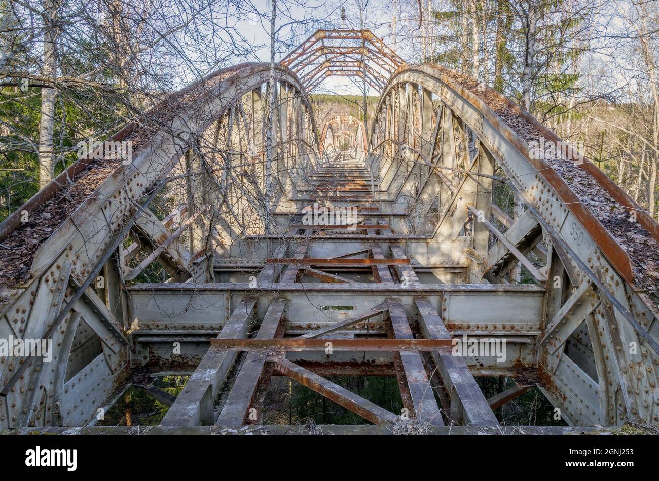 old rusty railway bridge with parts missing Stock Photo - Alamy