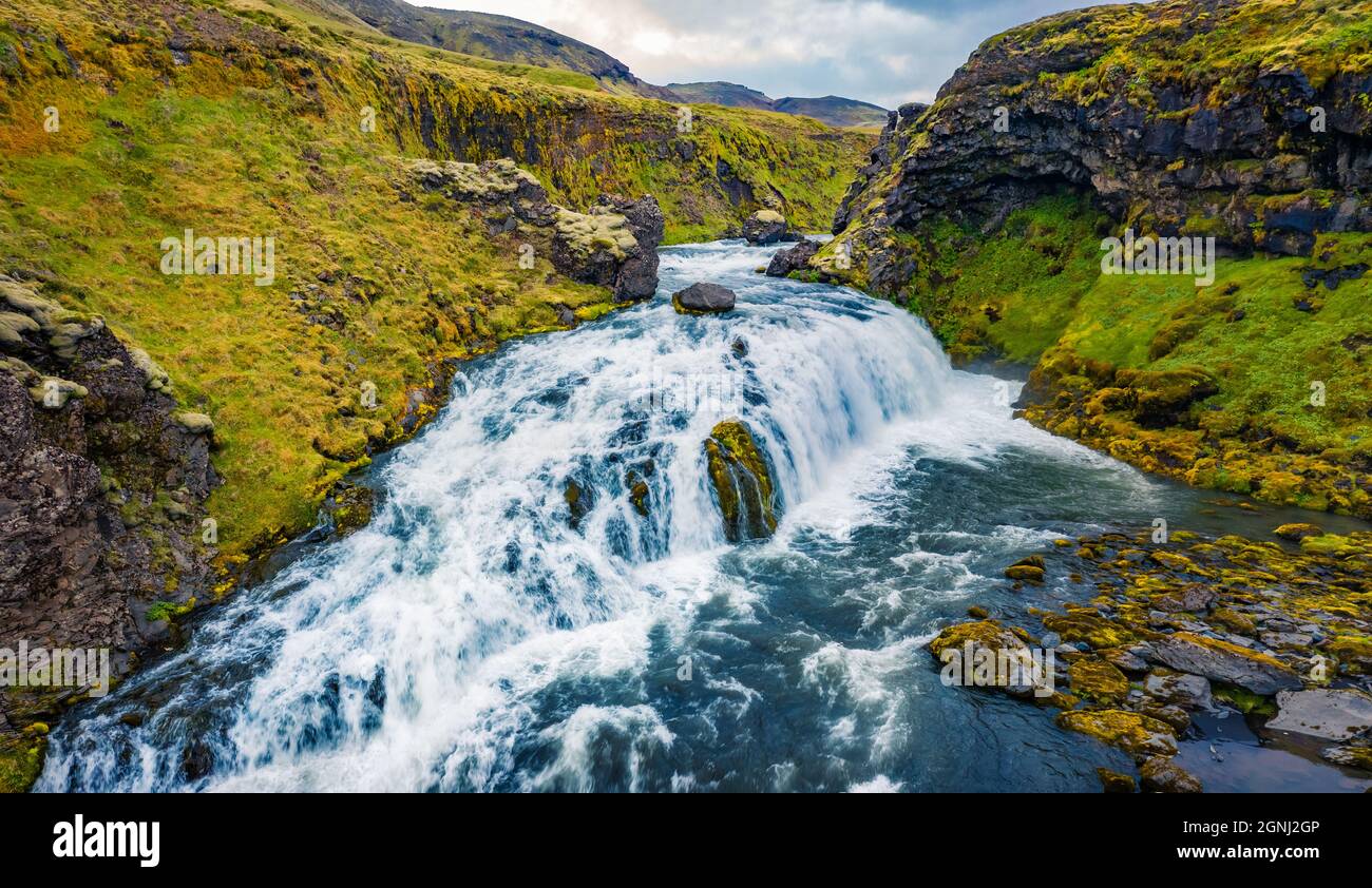 View from flying drone of waterfall on Skoga river. Splendid summer ...