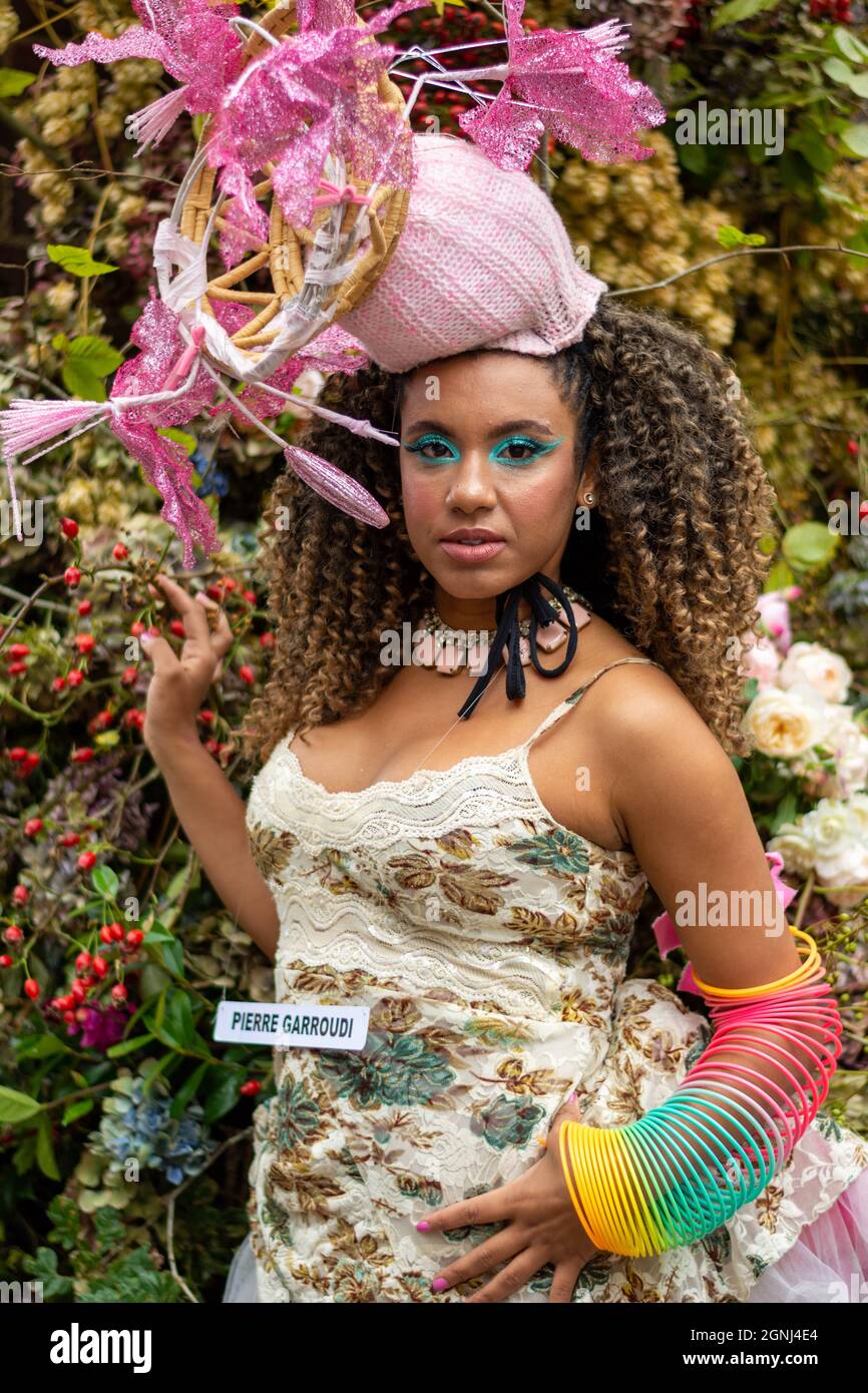 A model showcases Pierre Garroudi's latest colourful collection at one ...