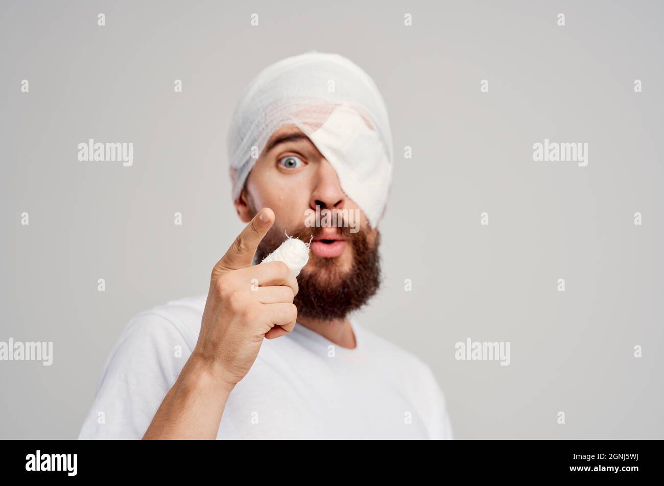 male patient with bandaged head and eye hospitalization isolated ...