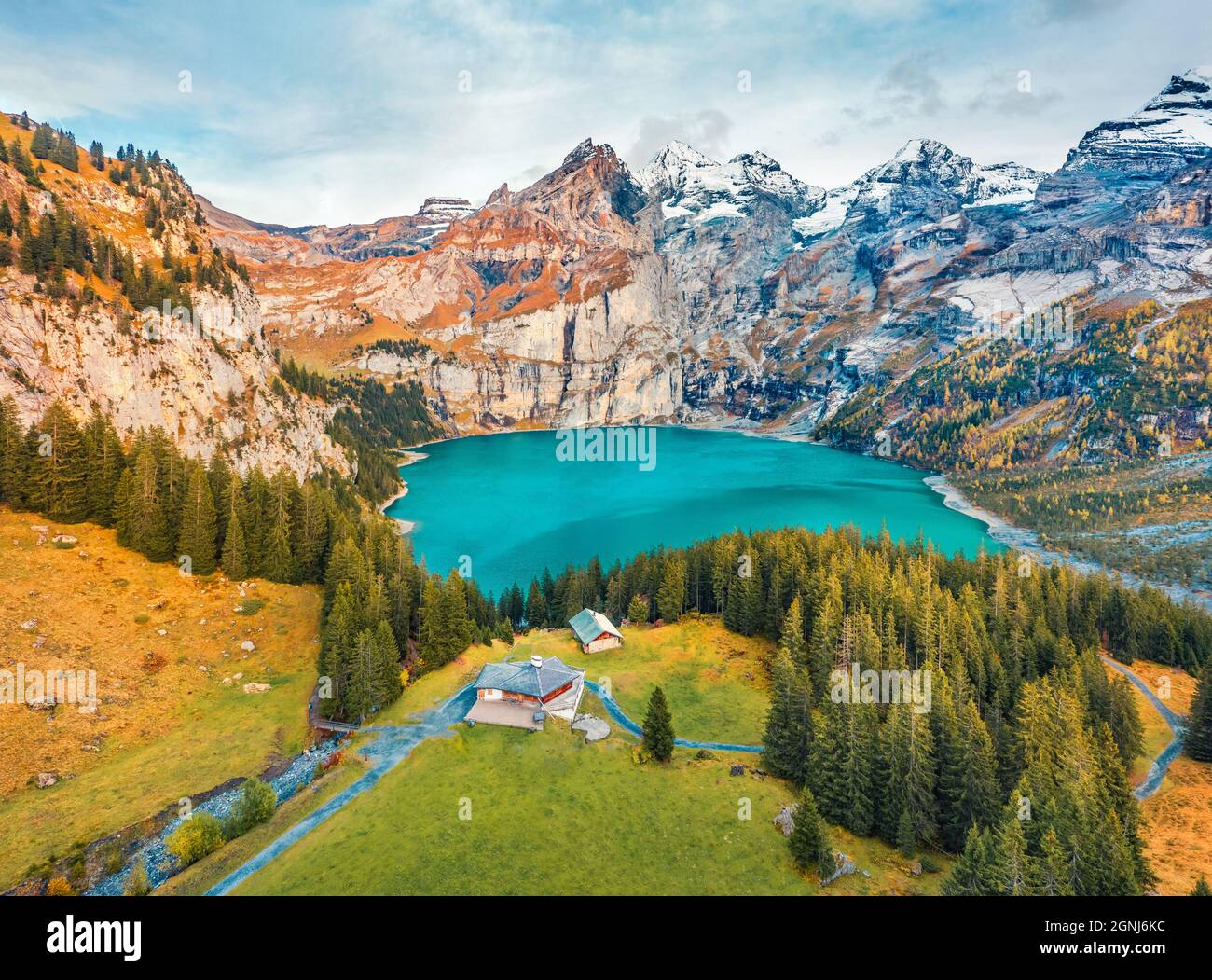 View from flying drone. Stunning autumn view of unique Oeschinensee ...