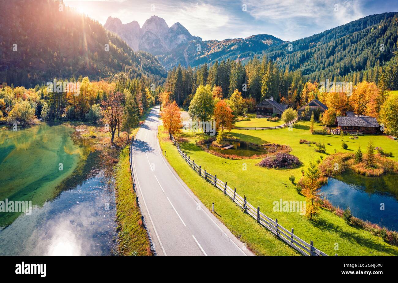 View from flying drone. Bright autumn view of Gosaubach lake. Romantic ...