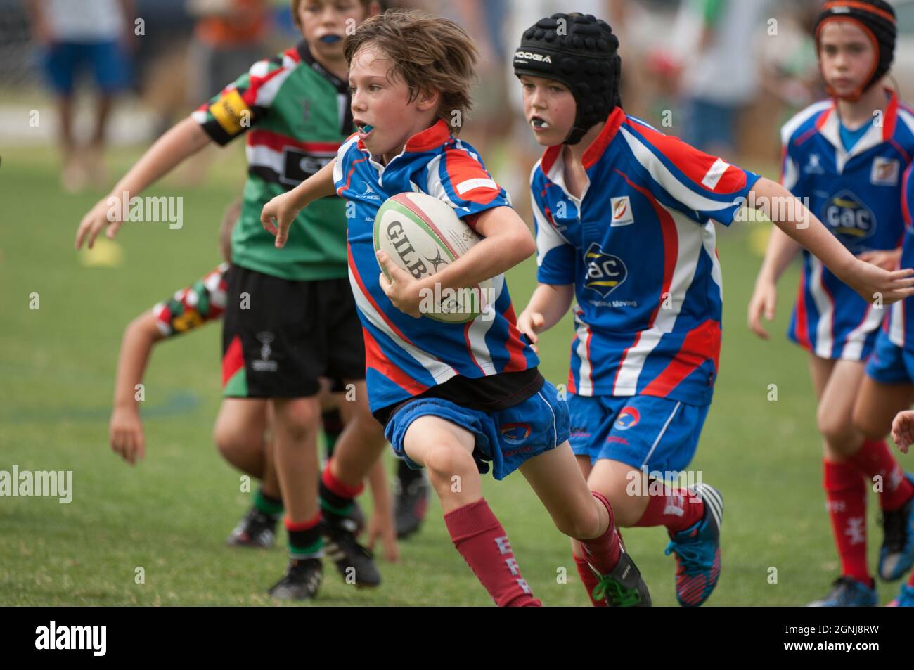 young kids paying rugby Stock Photo - Alamy