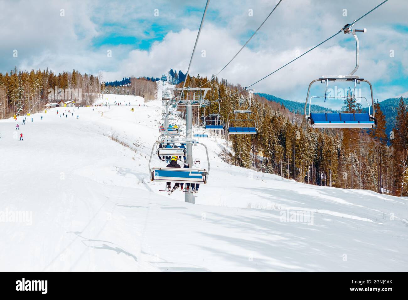 Ski slope resort . Ski Lift Connection . Snowy mountains and forest ...