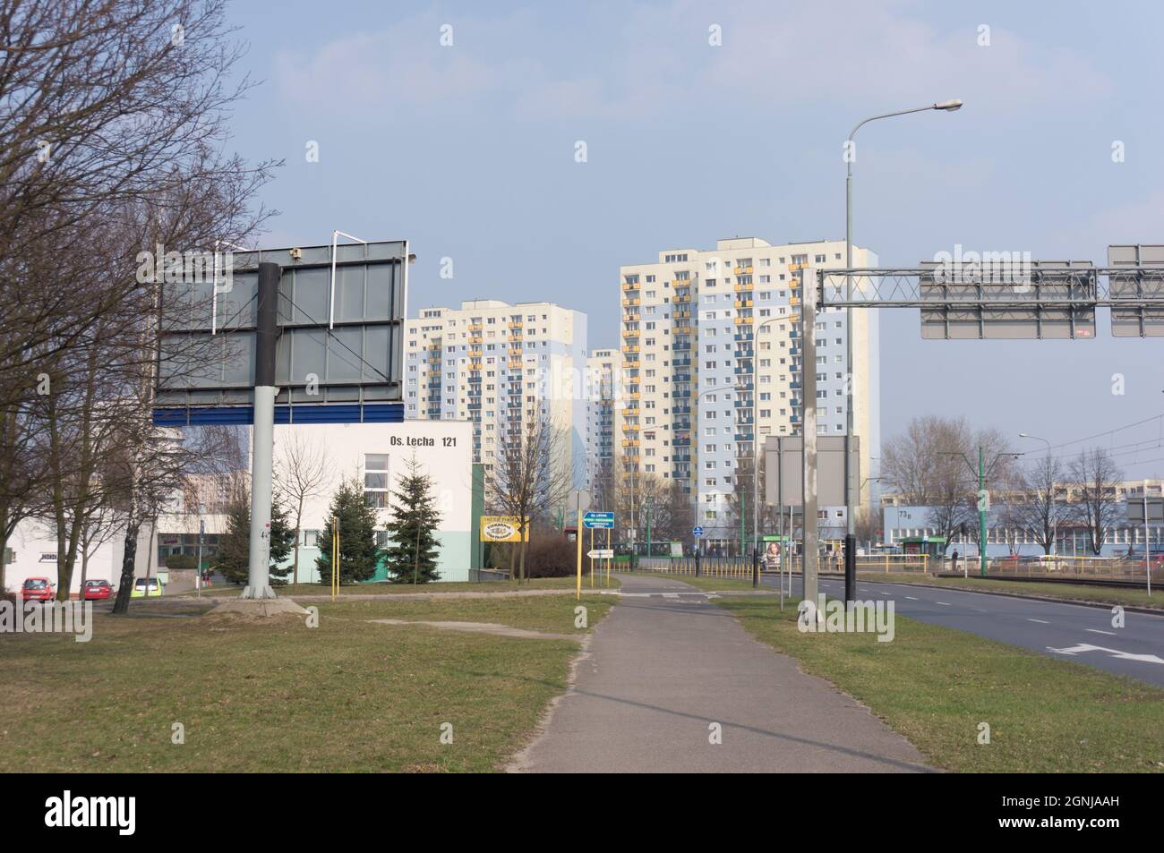 POZNAN, POLAND - Mar 21, 2015: An asphalt route and high-rise apartment ... POZNAN, POLAND - Mar 21, 2015: An asphalt route and high-rise apartment ...