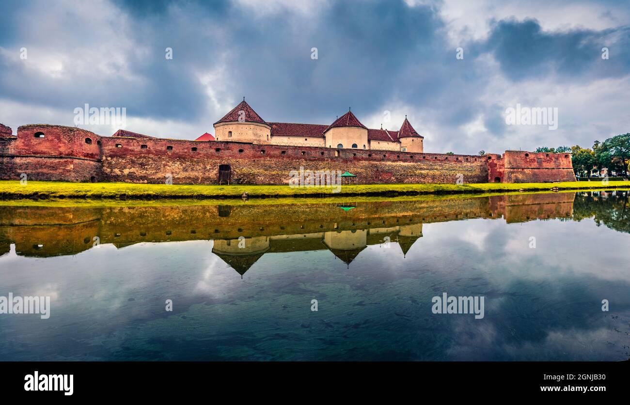 Panoramic summer view of medieval Fagaras Citadel. Dramatic evening ...