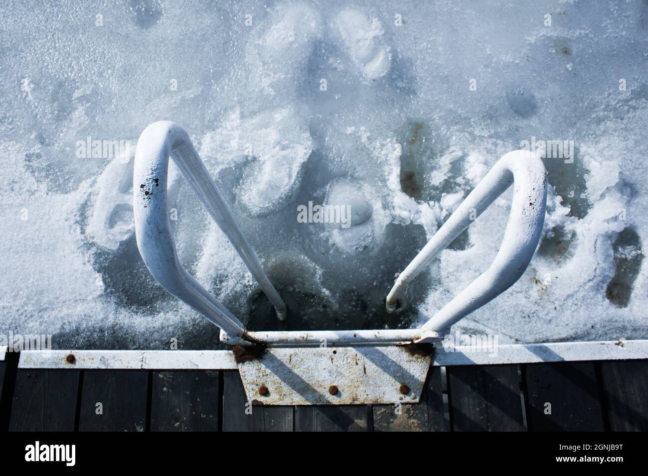 Water ladder for ice swim in a frozen lake in winter | Top down photo ...