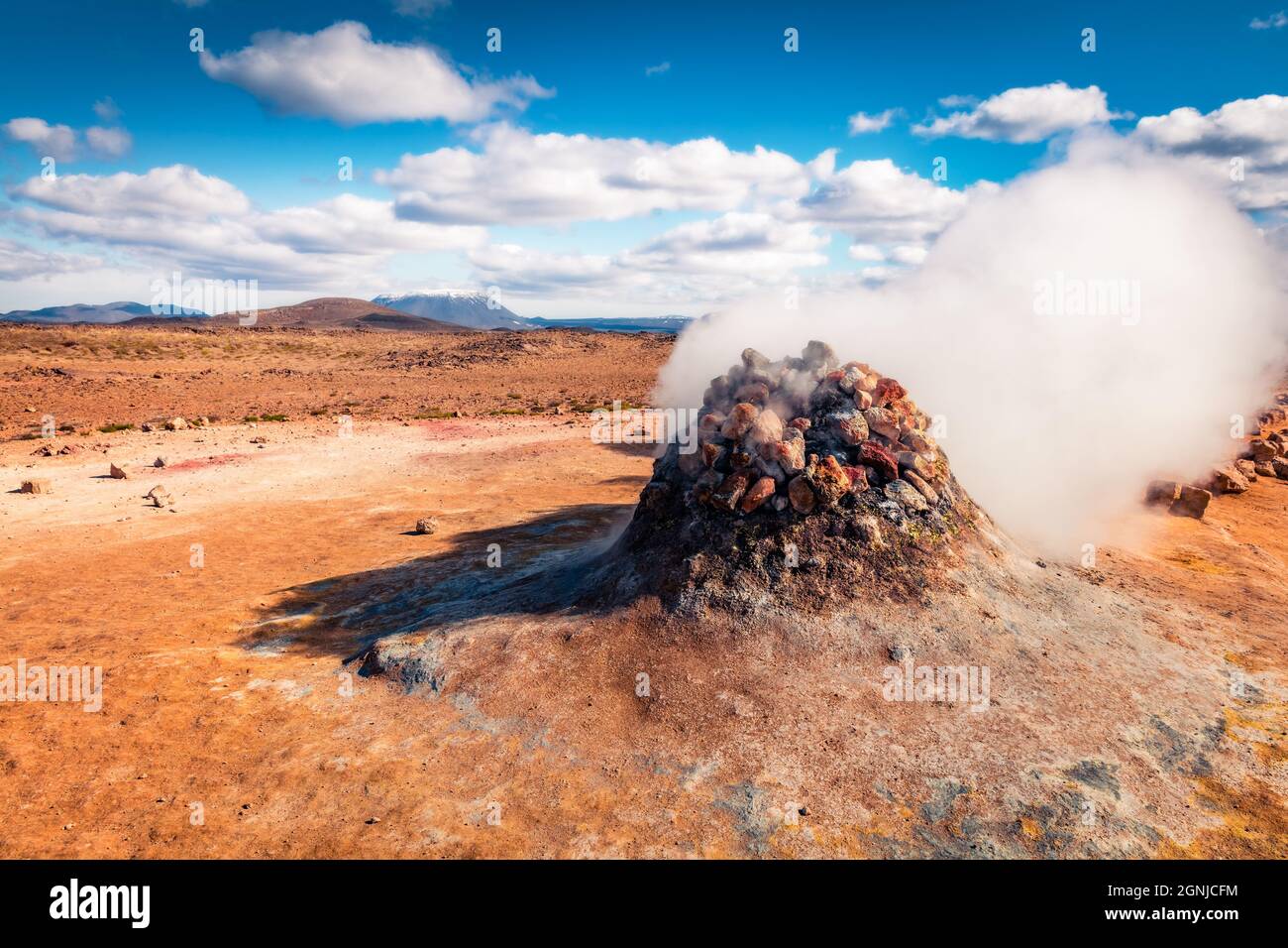 Steaming fumarole in geothermal valley Hverarond, Reykjahlid village ...