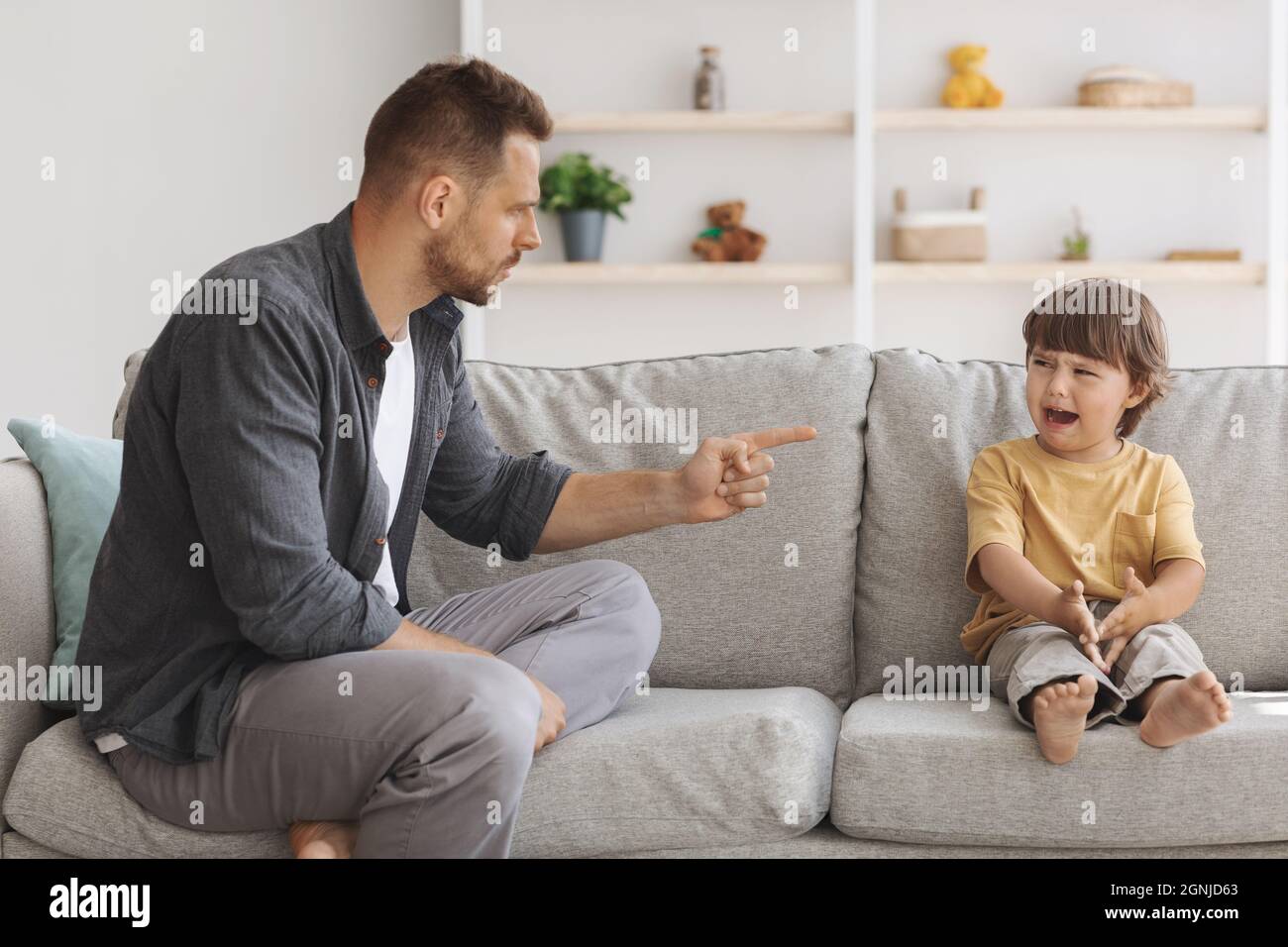 Domestic violence and kids abuse. Furious angry daddy shouling at his ...